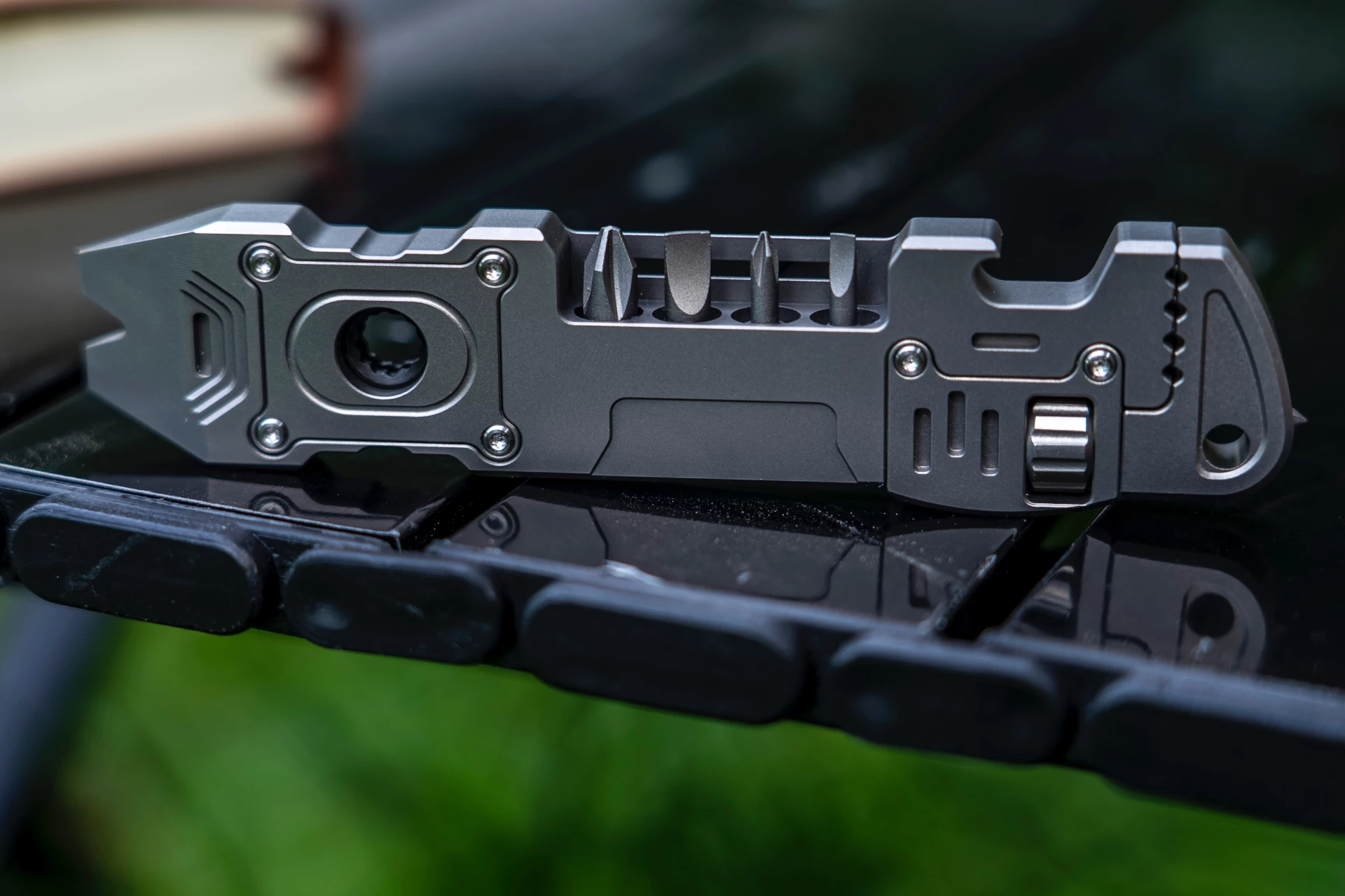 Six-function ratcheting titanium multitool packs its own bits