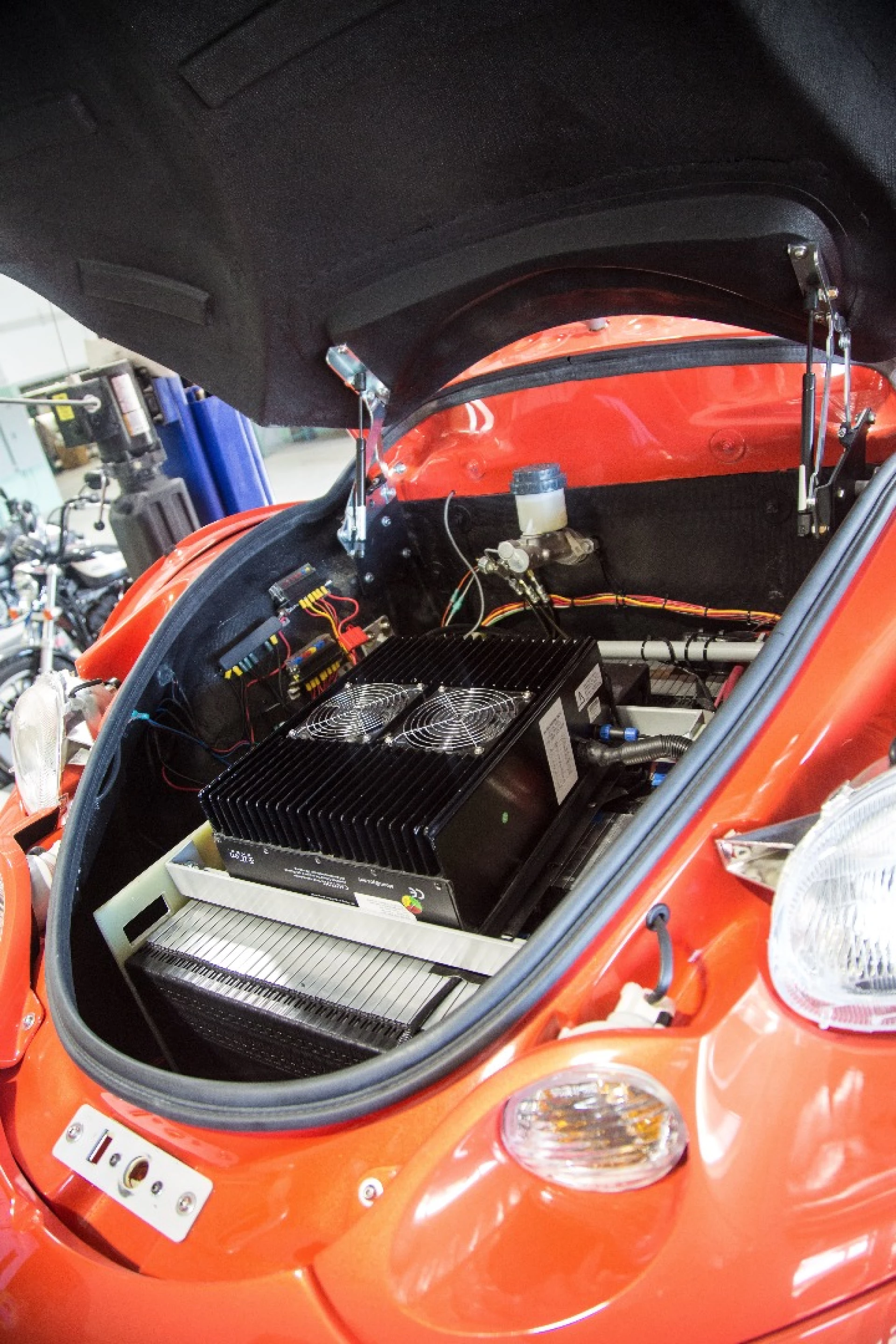 Corbin Sparrow electric three-wheeler, now with dimpled backside