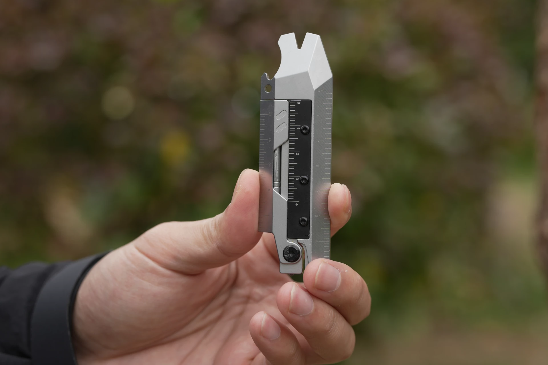 Steel folding-ruler multitool packs a pencil, caliper, pry bar and more