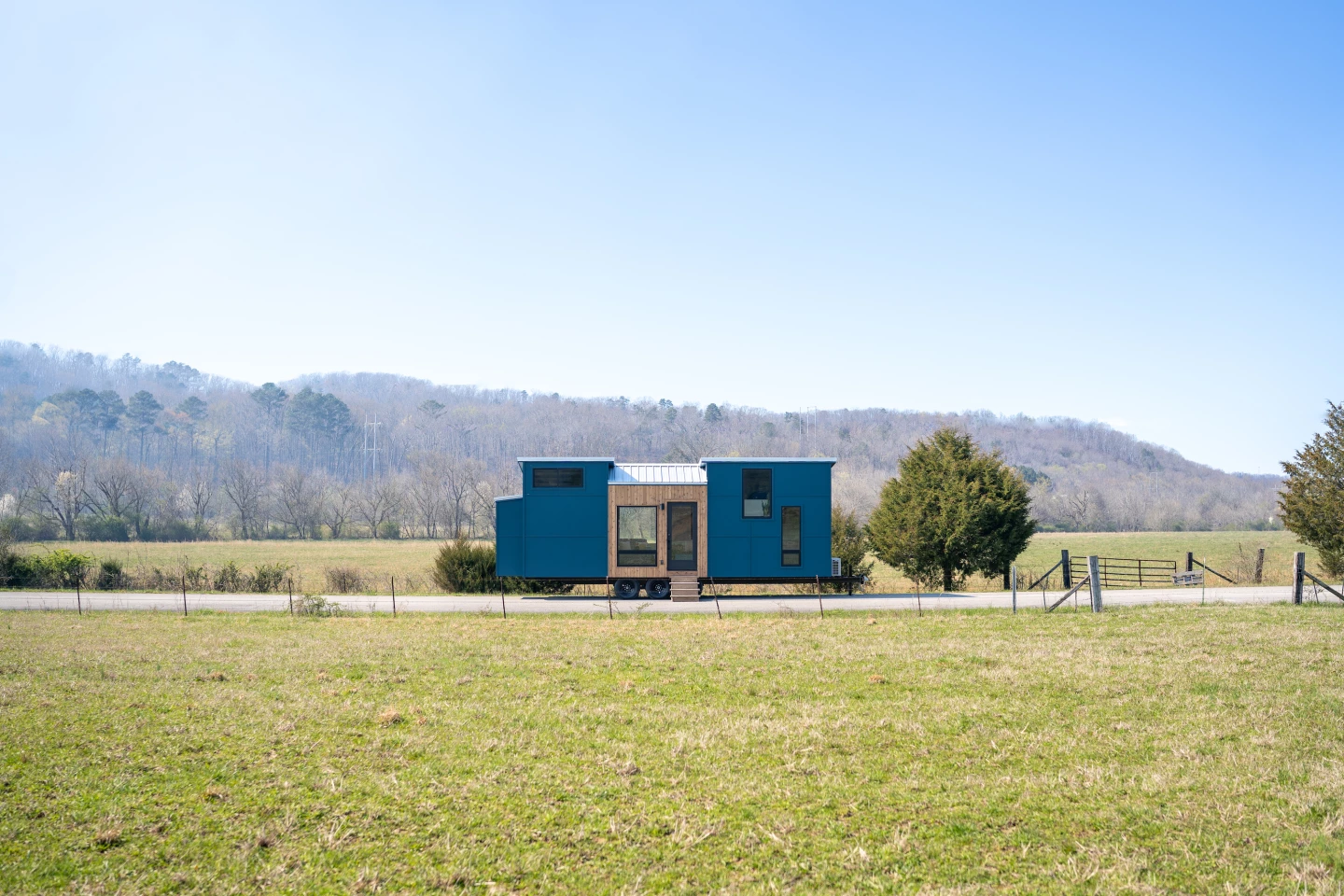 30-ft-long tiny house fits four into light-filled and airy interior