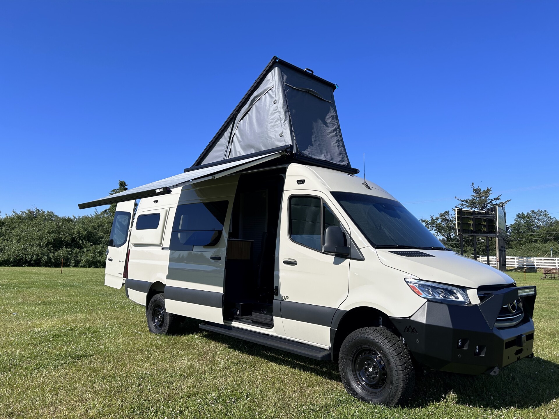 Sleek, rooftop tent-style camper pop-top doubles van capacity