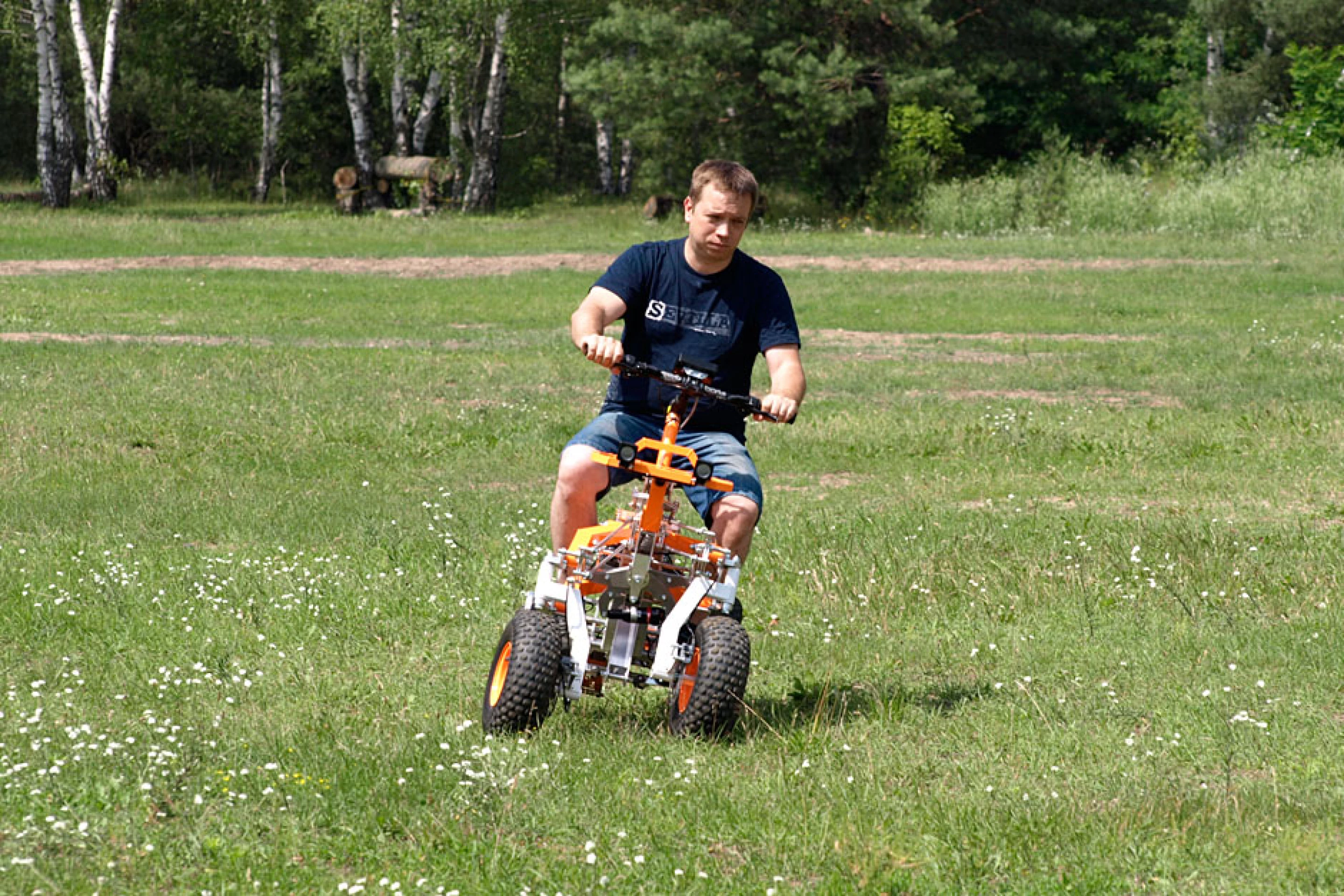 Tilting electric quad gets menacing off-road big brother