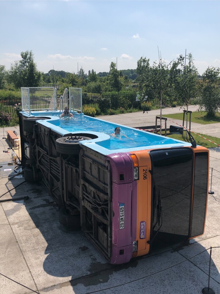 Artist transforms old bus into swimming pool