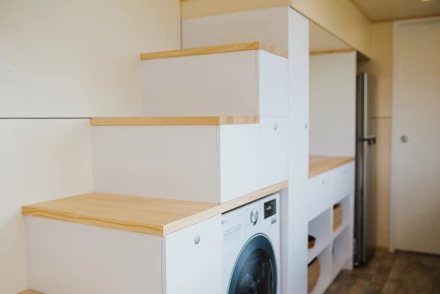 Nugget tiny house doubles up on staircases and storage space