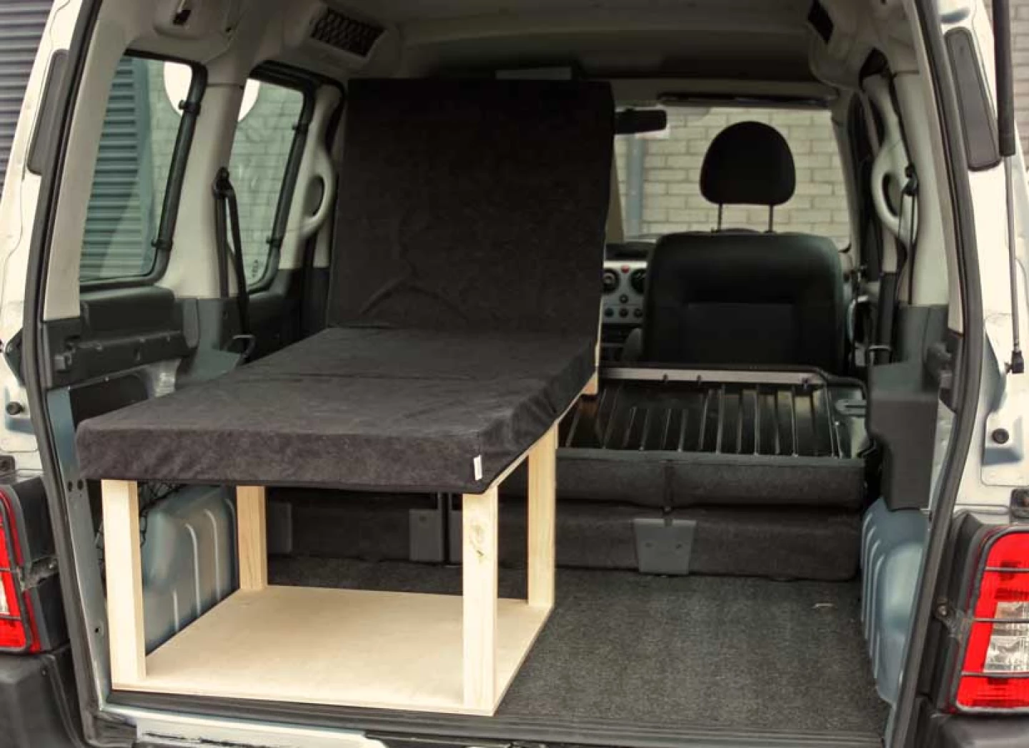 Simple kit turns small vans or crossovers into cozy micro campervans ...