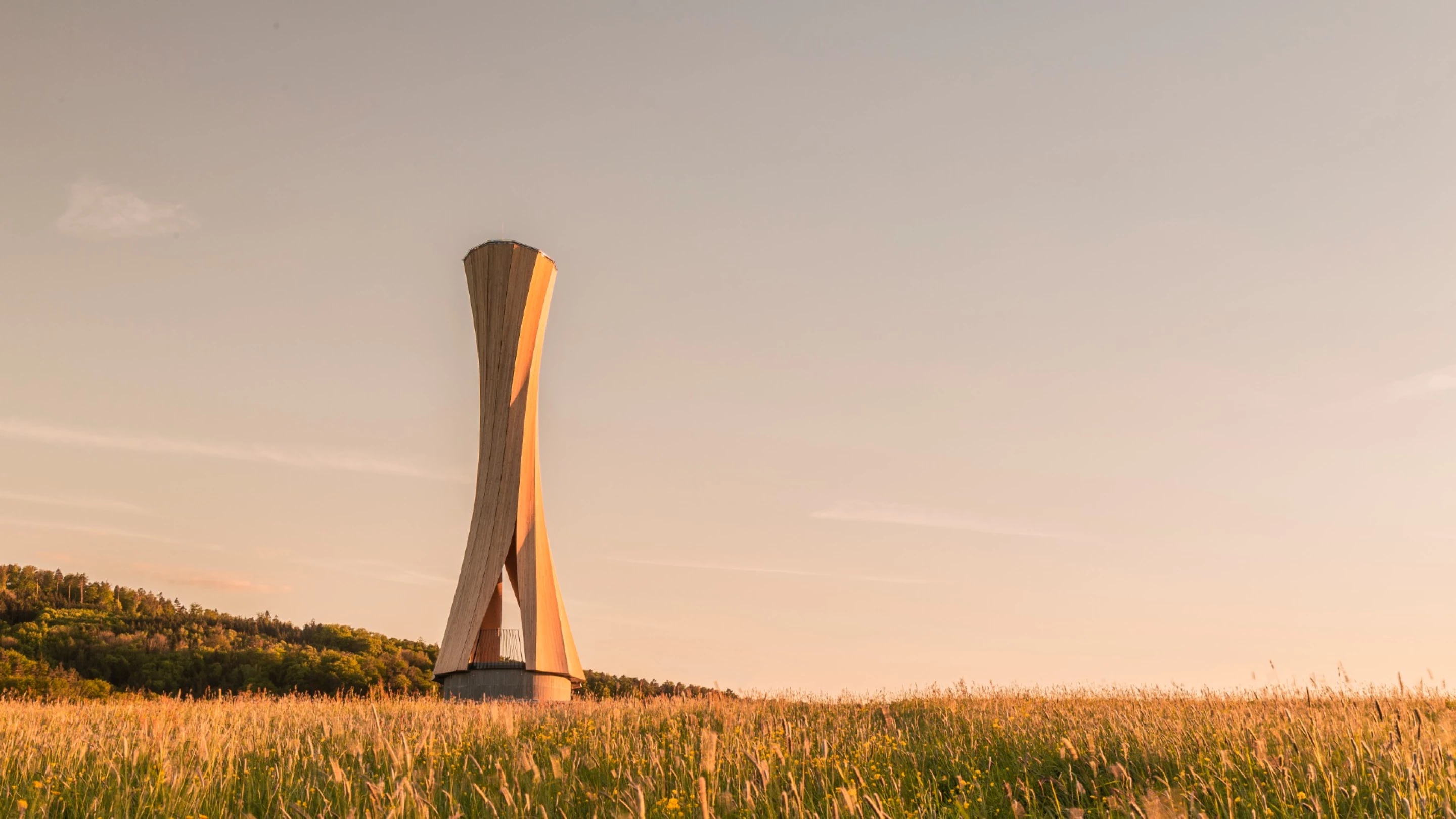 "World-first" twisting tower is made from timber that bends itself into ...