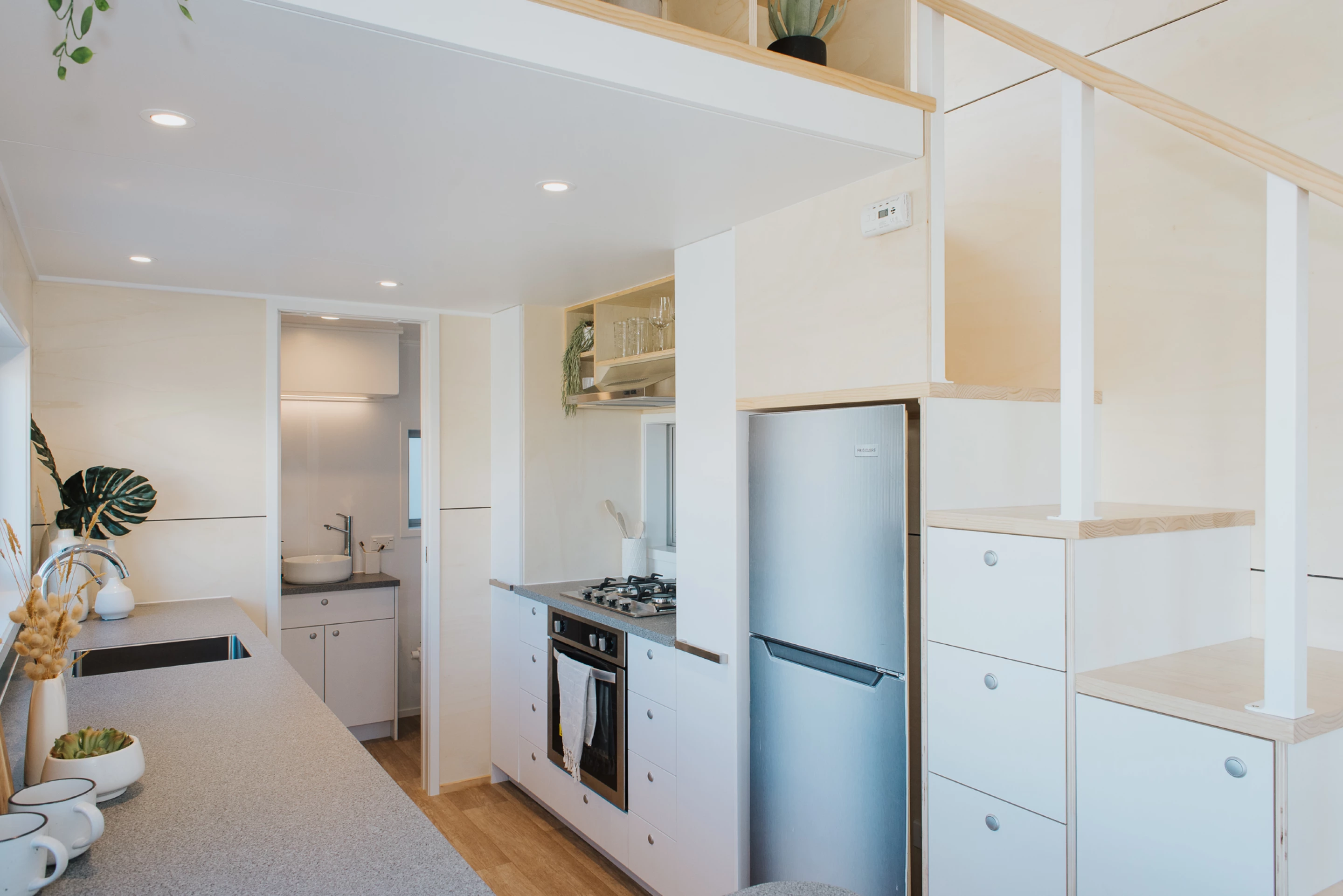 Compact tiny house puts a new spin on homework with loft-based office