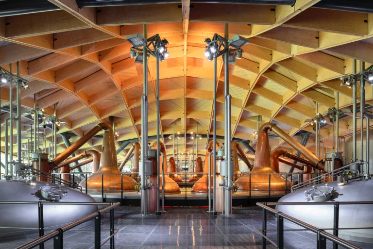 Scottish whisky distillery blends into the landscape with undulating ...