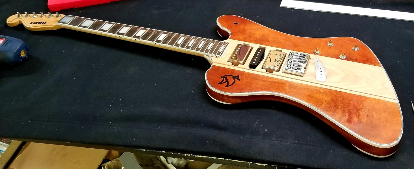 Genesis custom guitar splits in two for travel ease