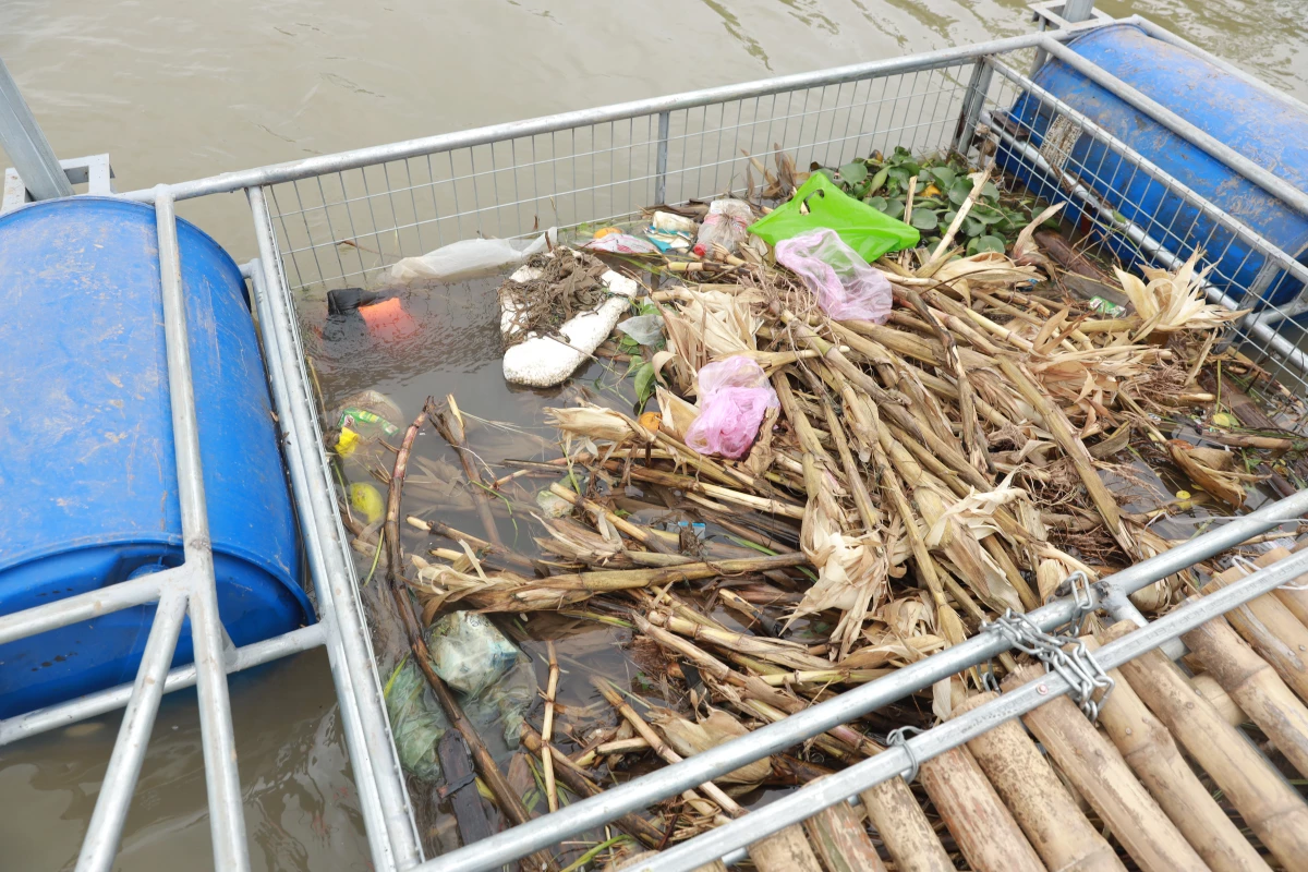 Trash trap gets to work removing plastic waste from Vietnam's Red River