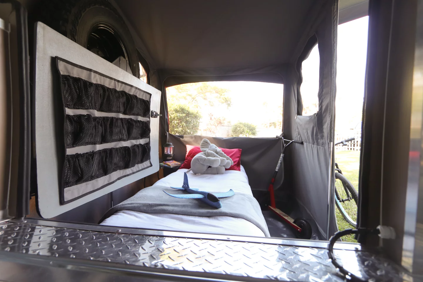 Badger Extreme camper trailer expands with roof that becomes a room