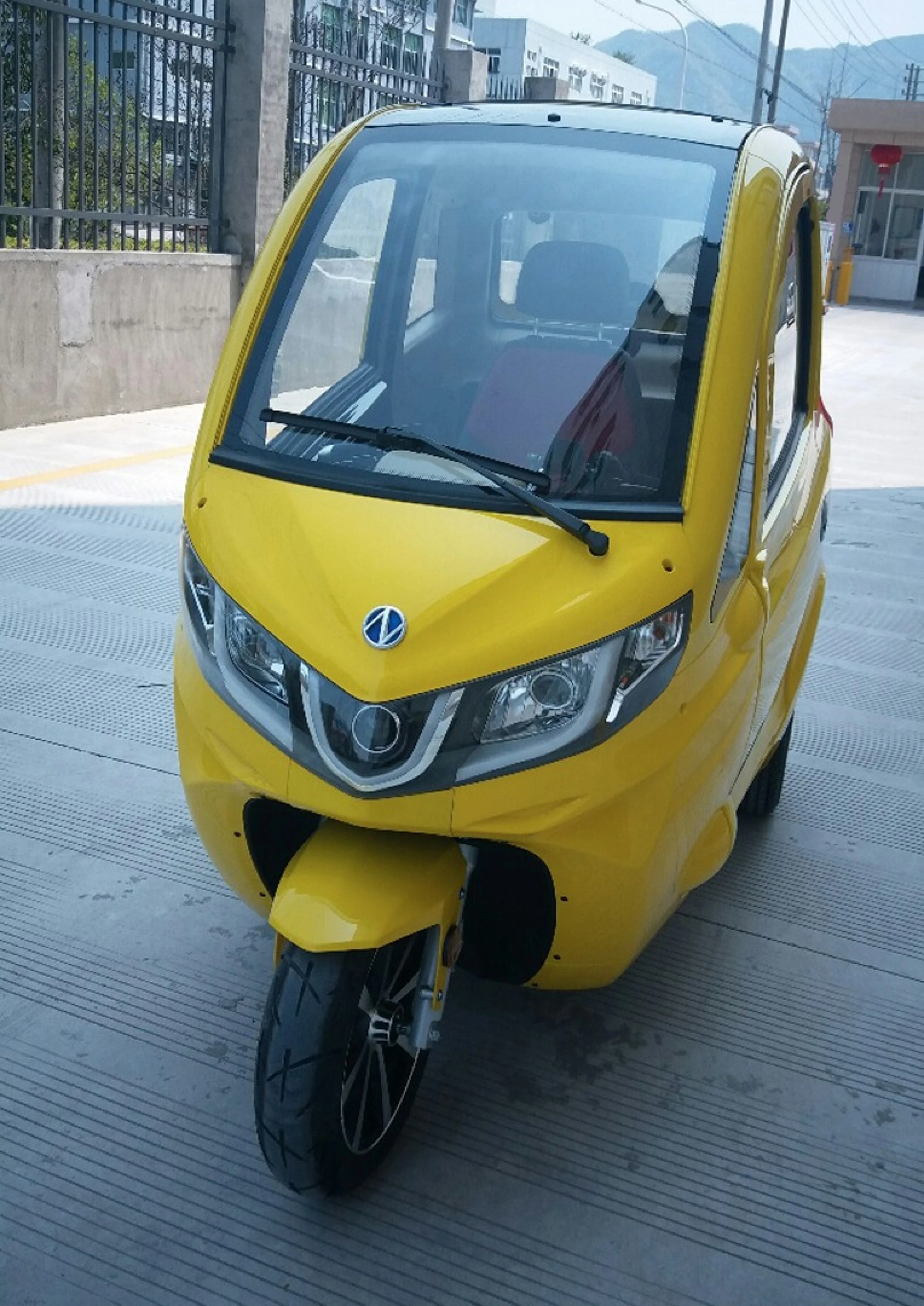 $5,700 electric micro-car seats 3, or carries 360 lb of cargo