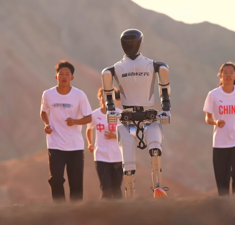Watch: Sneaker-wearing humanoid beats barefoot bot on Gobi fun run