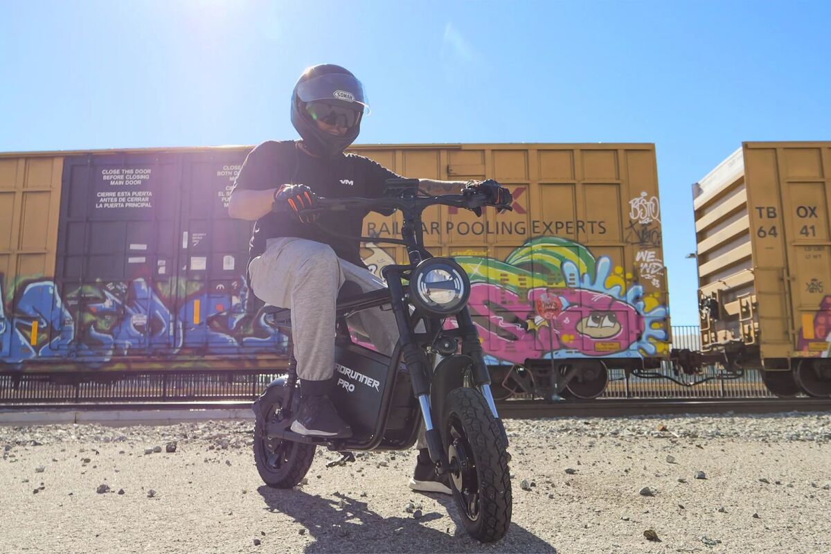 Roadrunner Pro seated e-scoot rides with 1,800-Wh battery and 4-kW motors