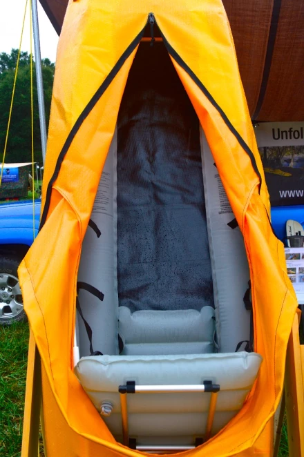 Backpackable boat unfolds and inflates into paddling form