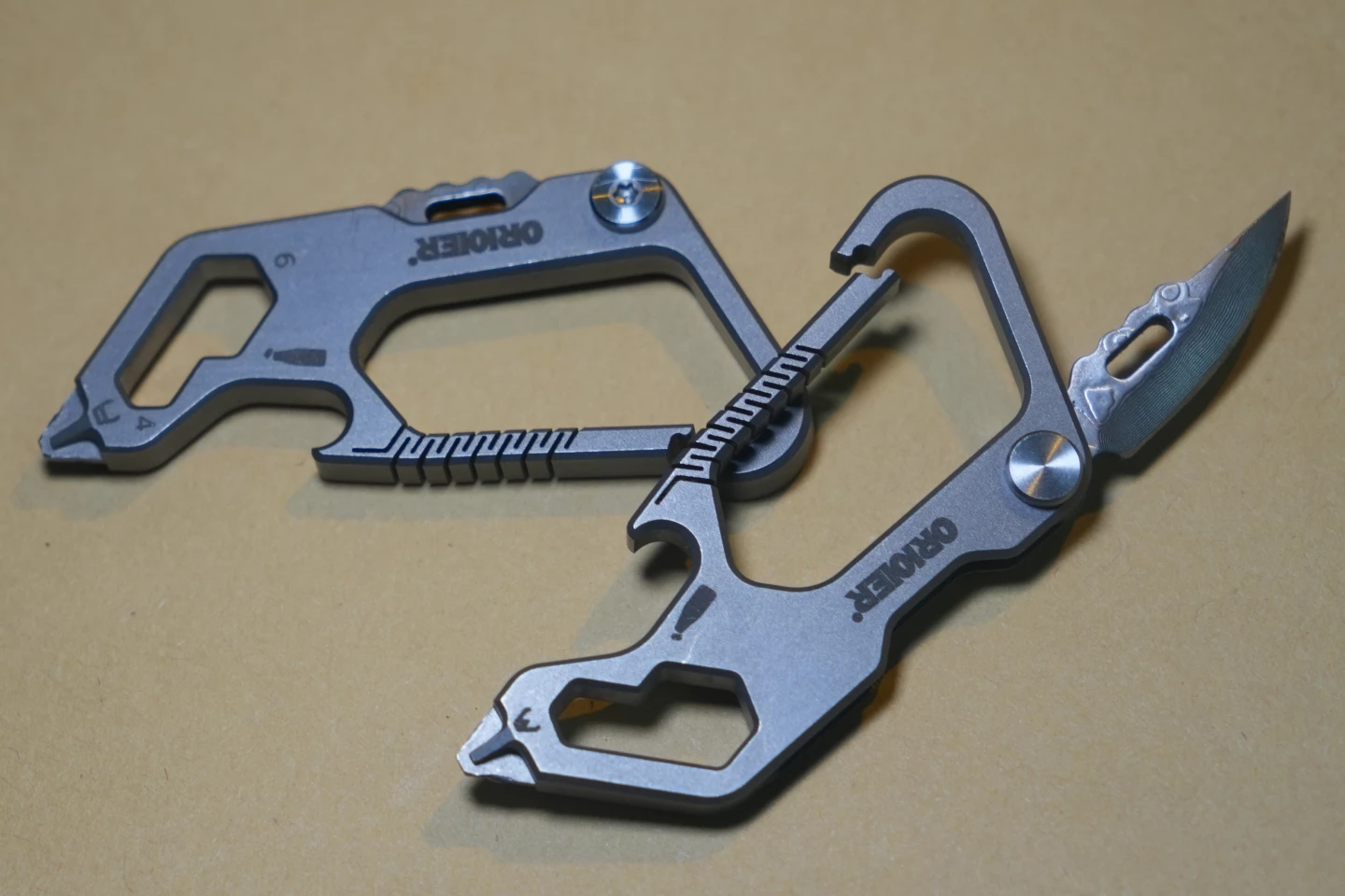 Tiny titanium tool packs screwdrivers, wrenches, and a Damascus steel blade