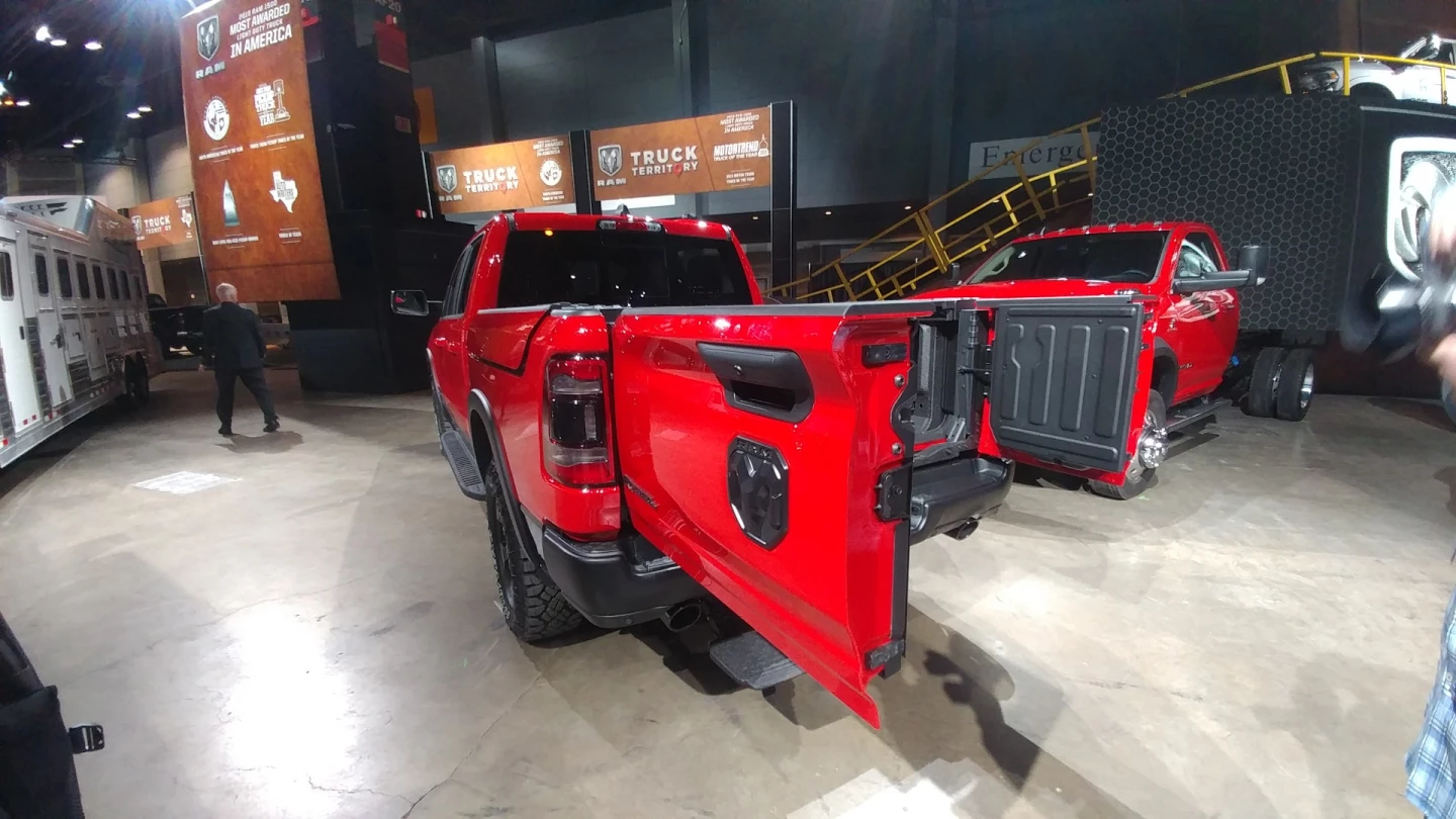 Ram 1500's new tailgate folds and swings for access with or without a ...