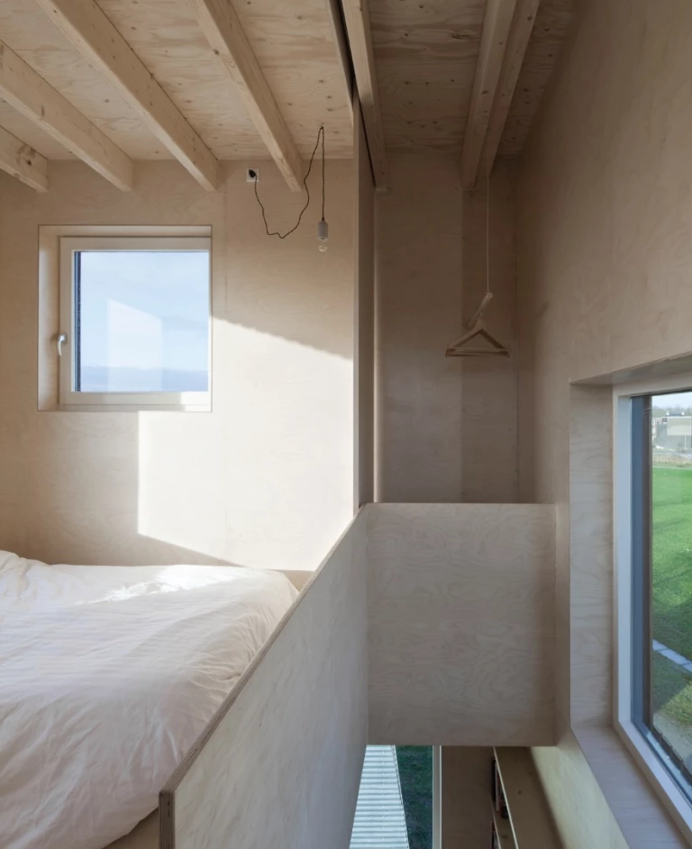 Skinny house is smaller than a couple of parking spaces