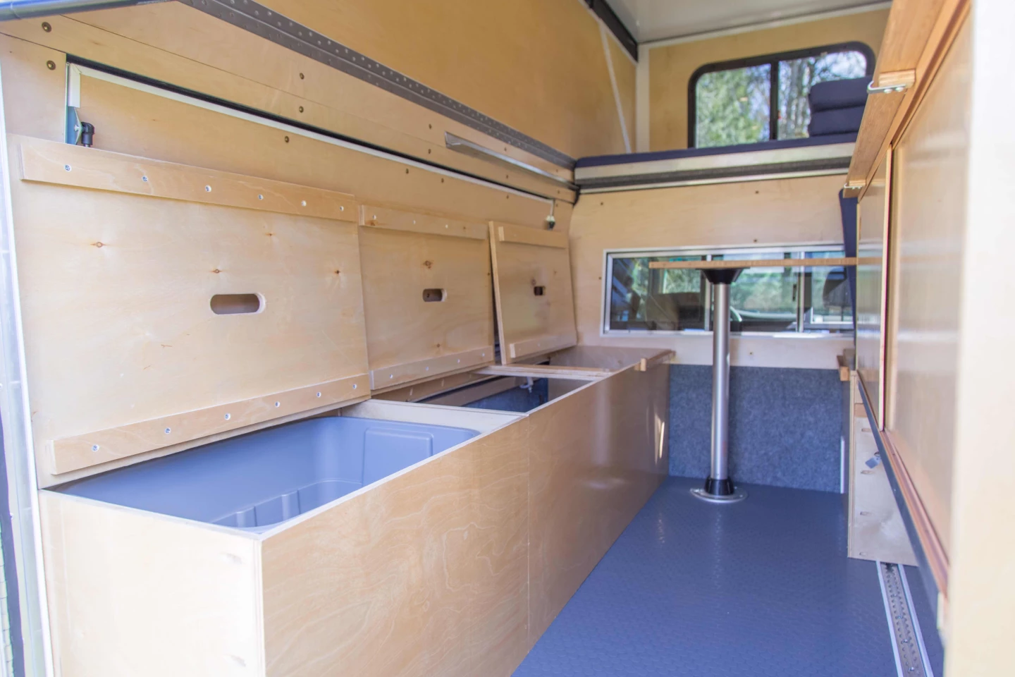 Hiatus truck camper unfolds into roomy hard-walled penthouse