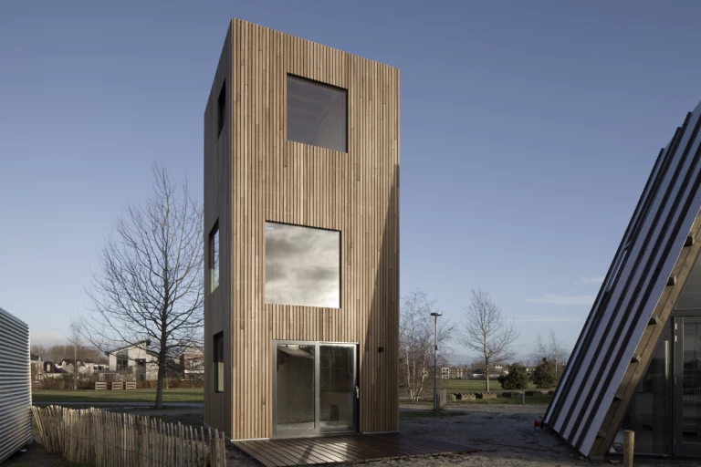 Skinny house is smaller than a couple of parking spaces