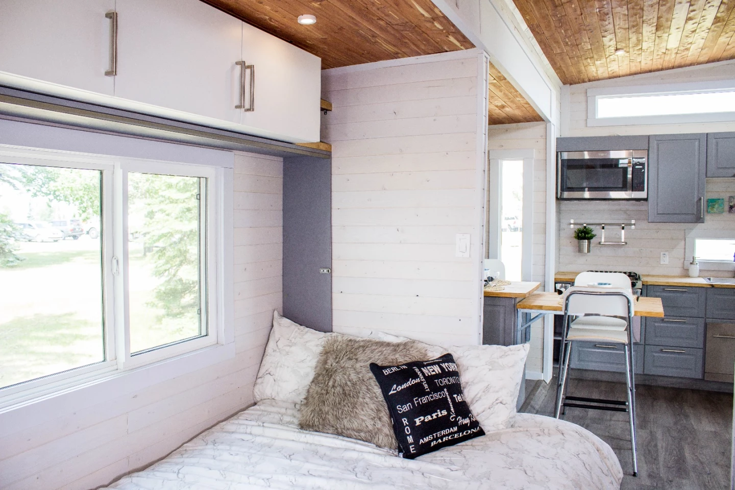 Compact tiny house expands in size to offer more living space