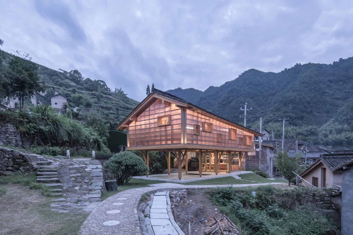 Elevated library glows invitingly in rural China