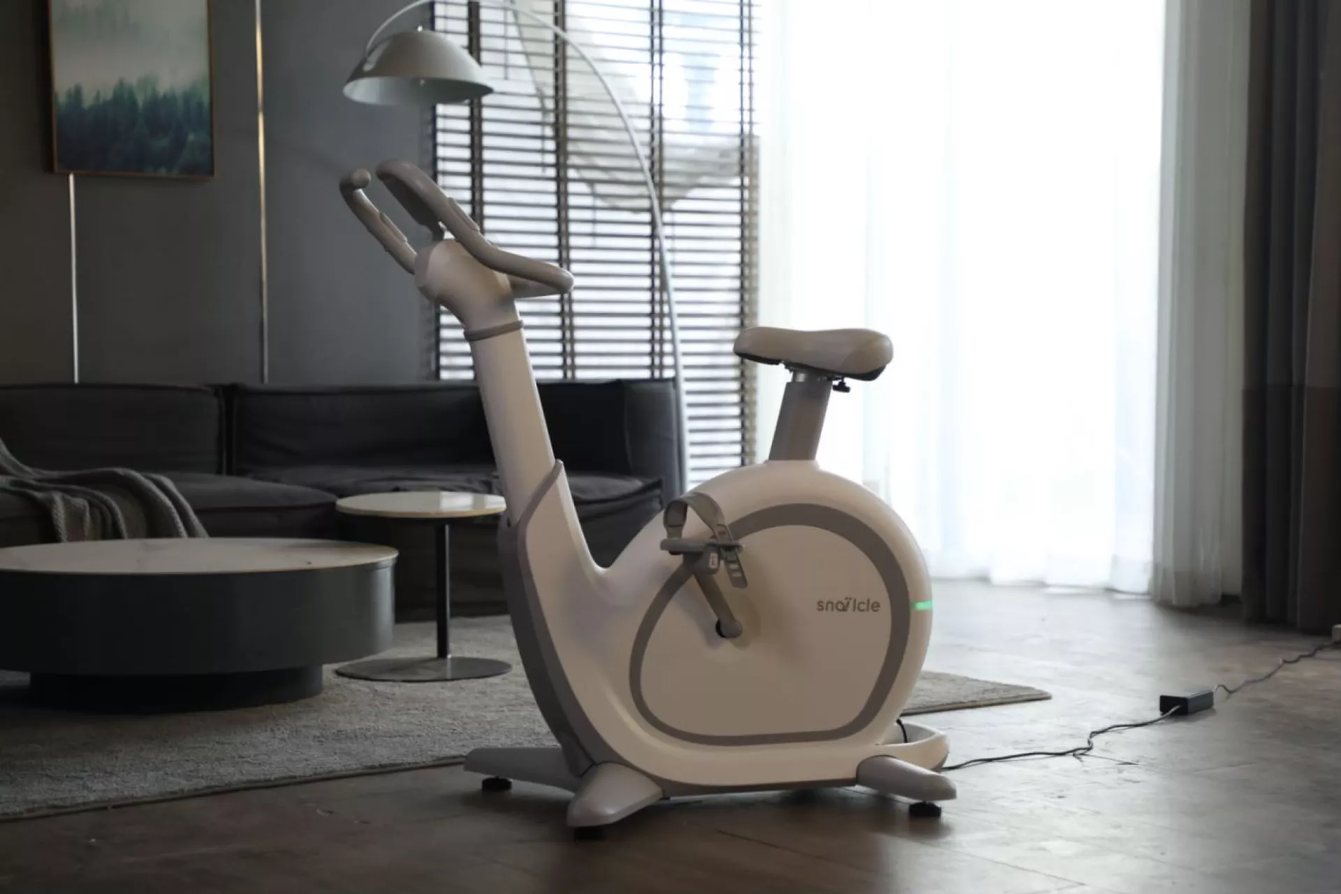 Snail-shaped stationary bike rises to the challenge of indoor training