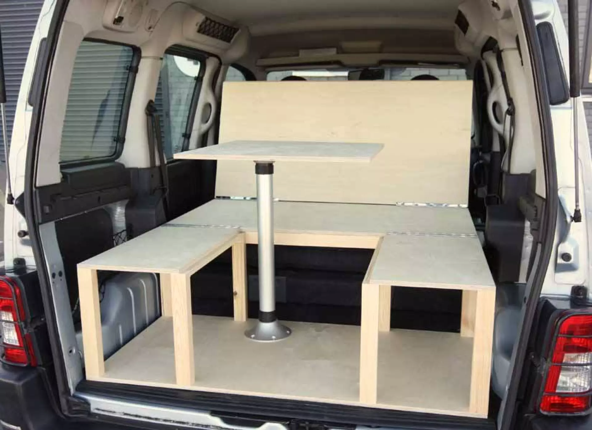 Simple kit turns small vans or crossovers into cozy micro campervans ...