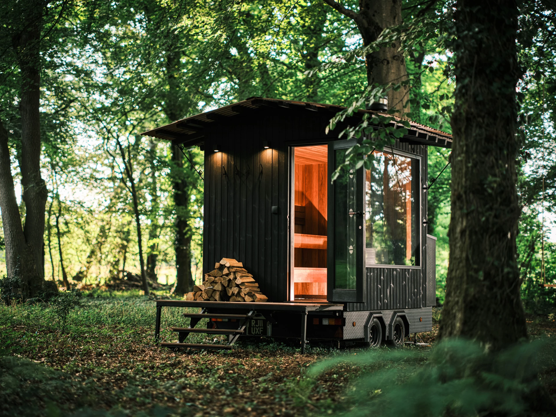 Aquila tiny house-style sauna delivers a mobile spa for up to six people
