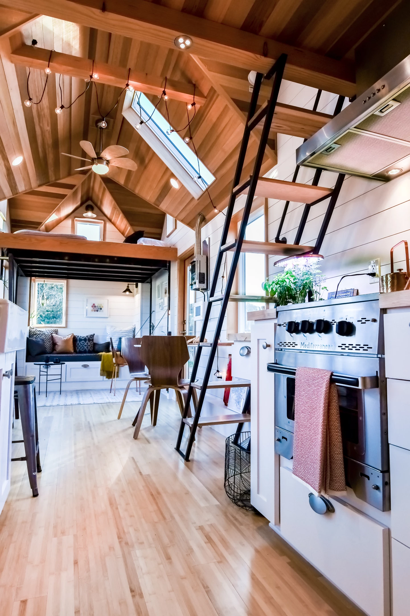 Elevating bed provides tiny house interior flexibility