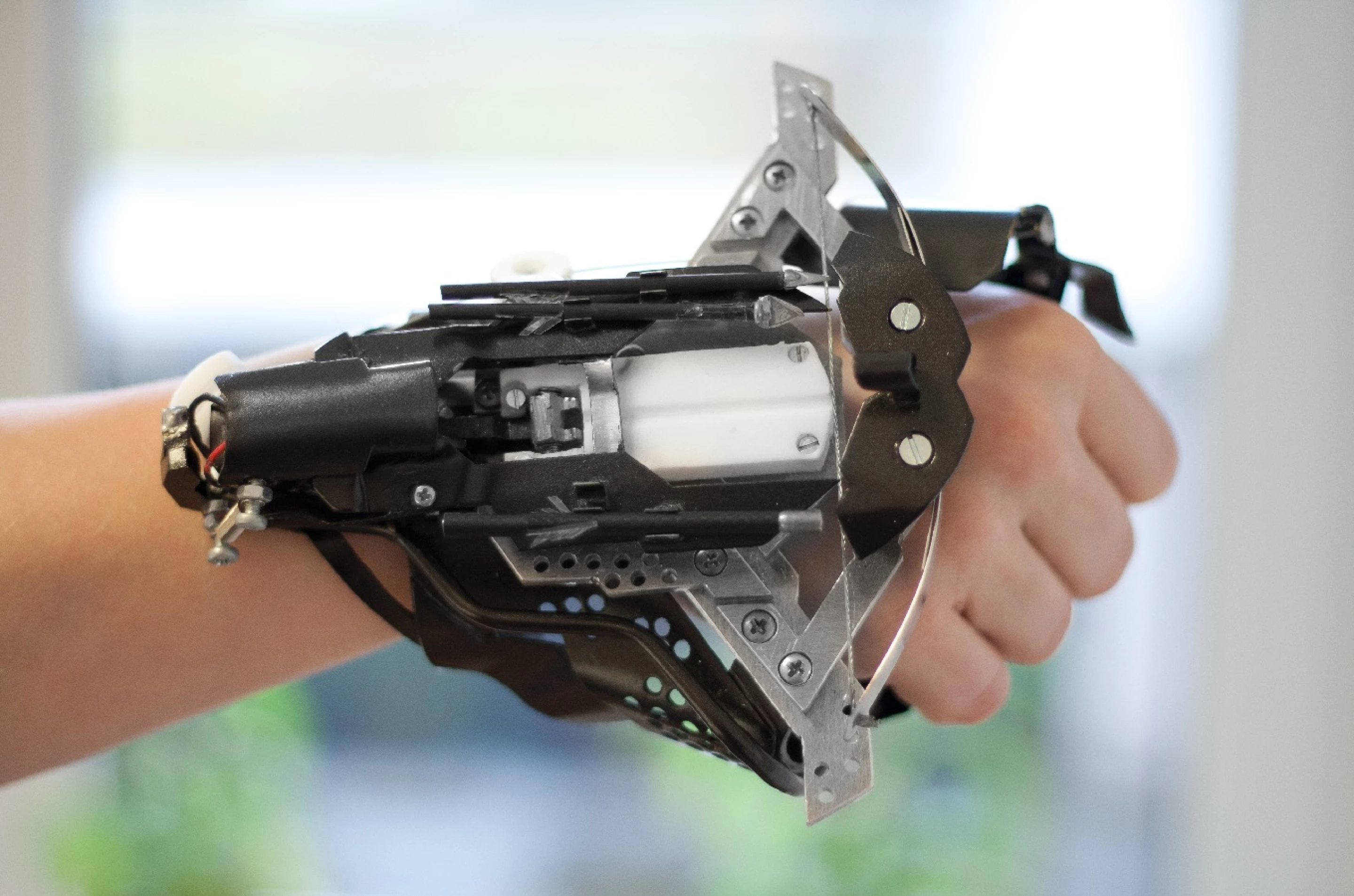 How do you top a wrist-mounted crossbow? With one that's semi-automatic ...
