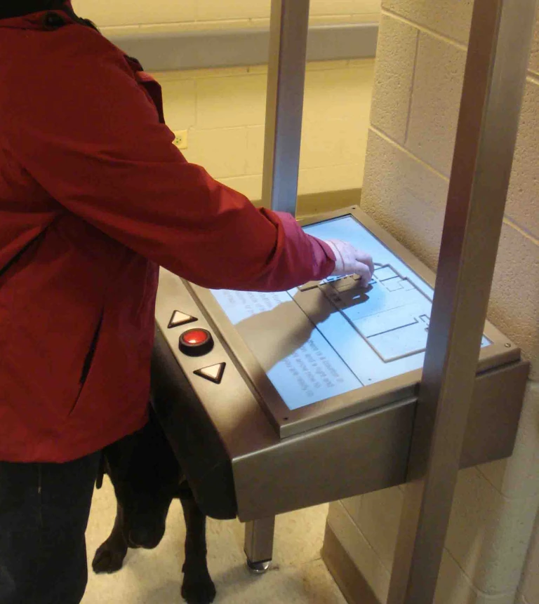 Touch-sensitive 3D maps guide the blind with spoken instructions