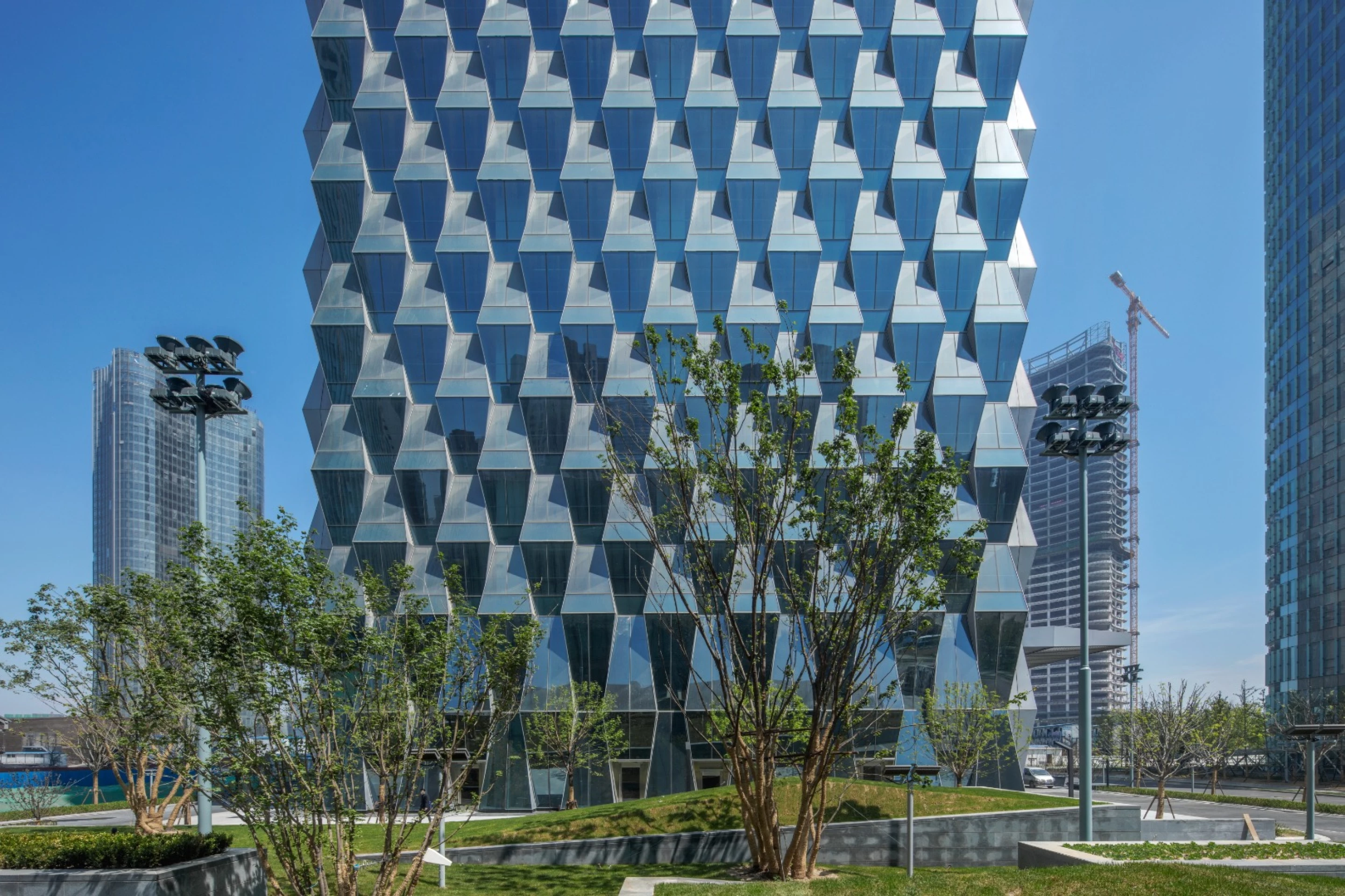Beijing tower reflects on energy efficiency with trapezoidal glass facade