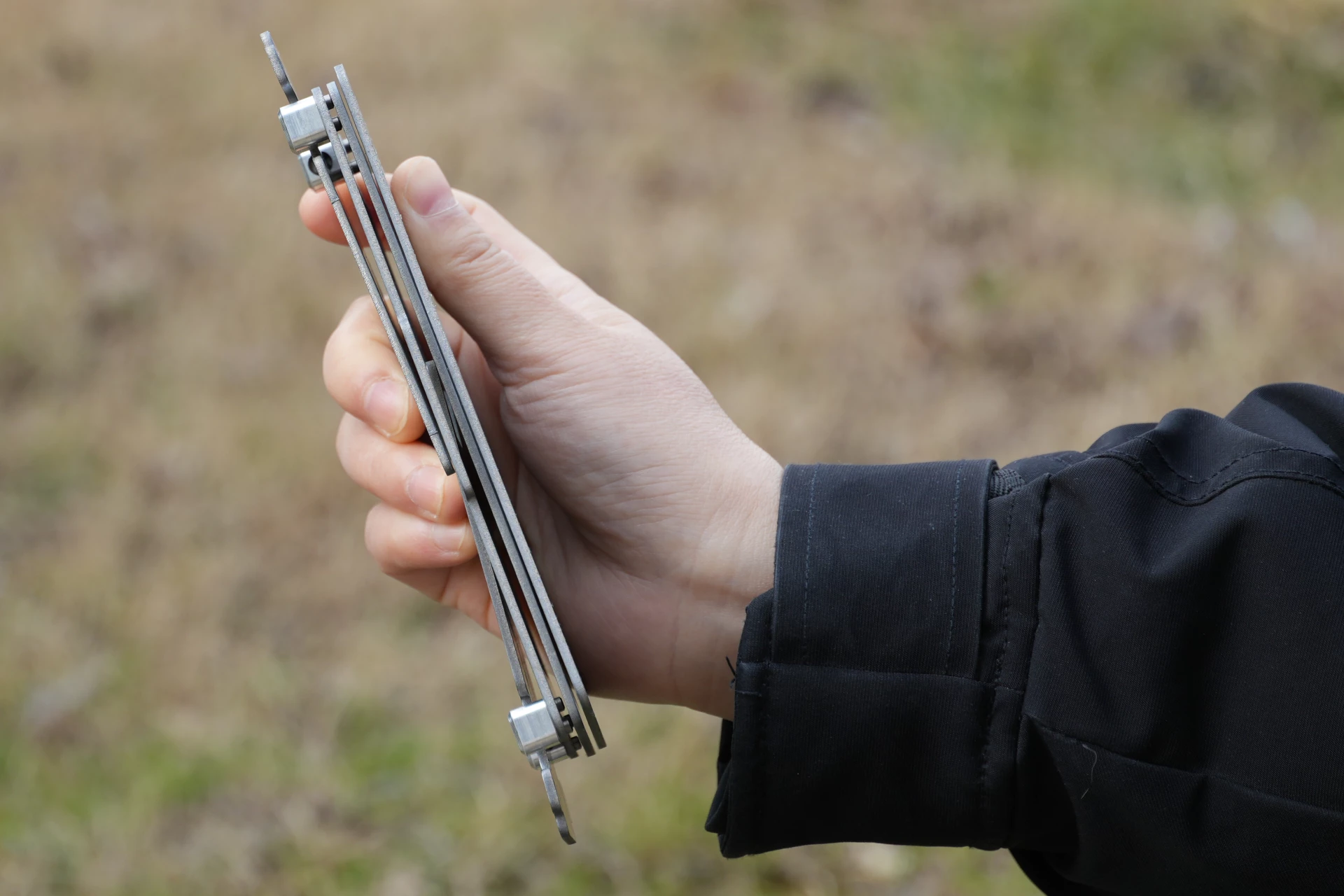 Ultralight titanium camp stove packs flat for easy hiking