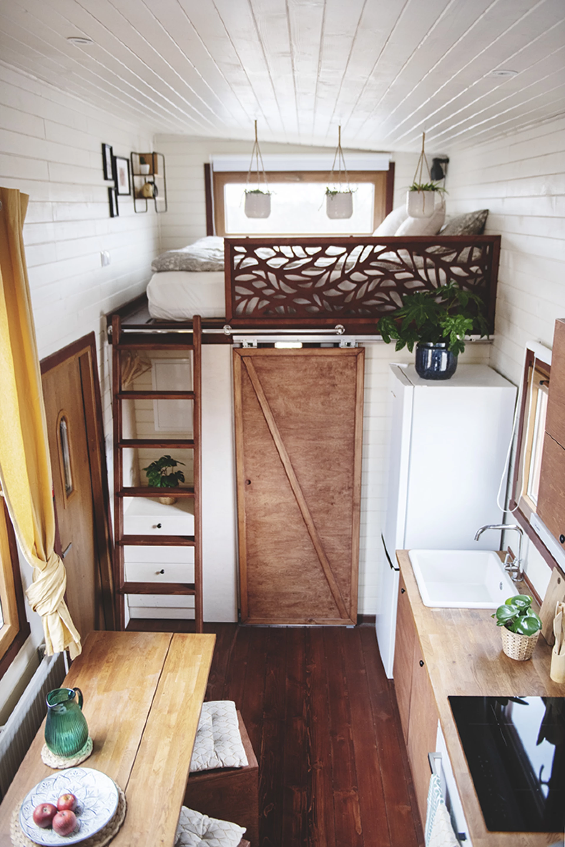 Elise tiny house lifts the living room to fit family of three