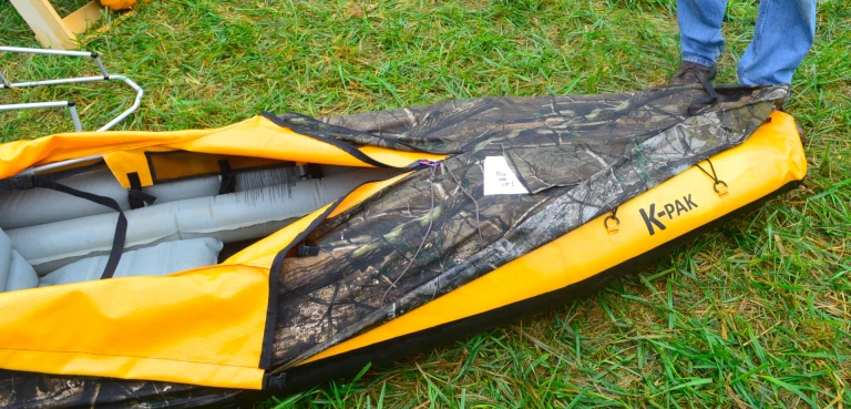 Backpackable boat unfolds and inflates into paddling form