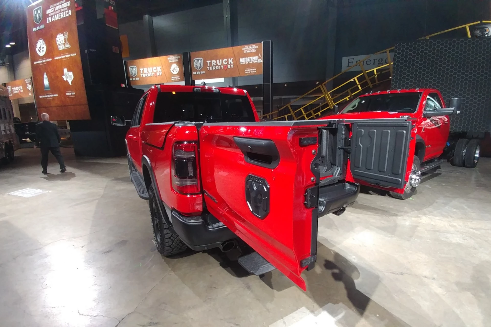 Ram 1500's new tailgate folds and swings for access with or without a ...