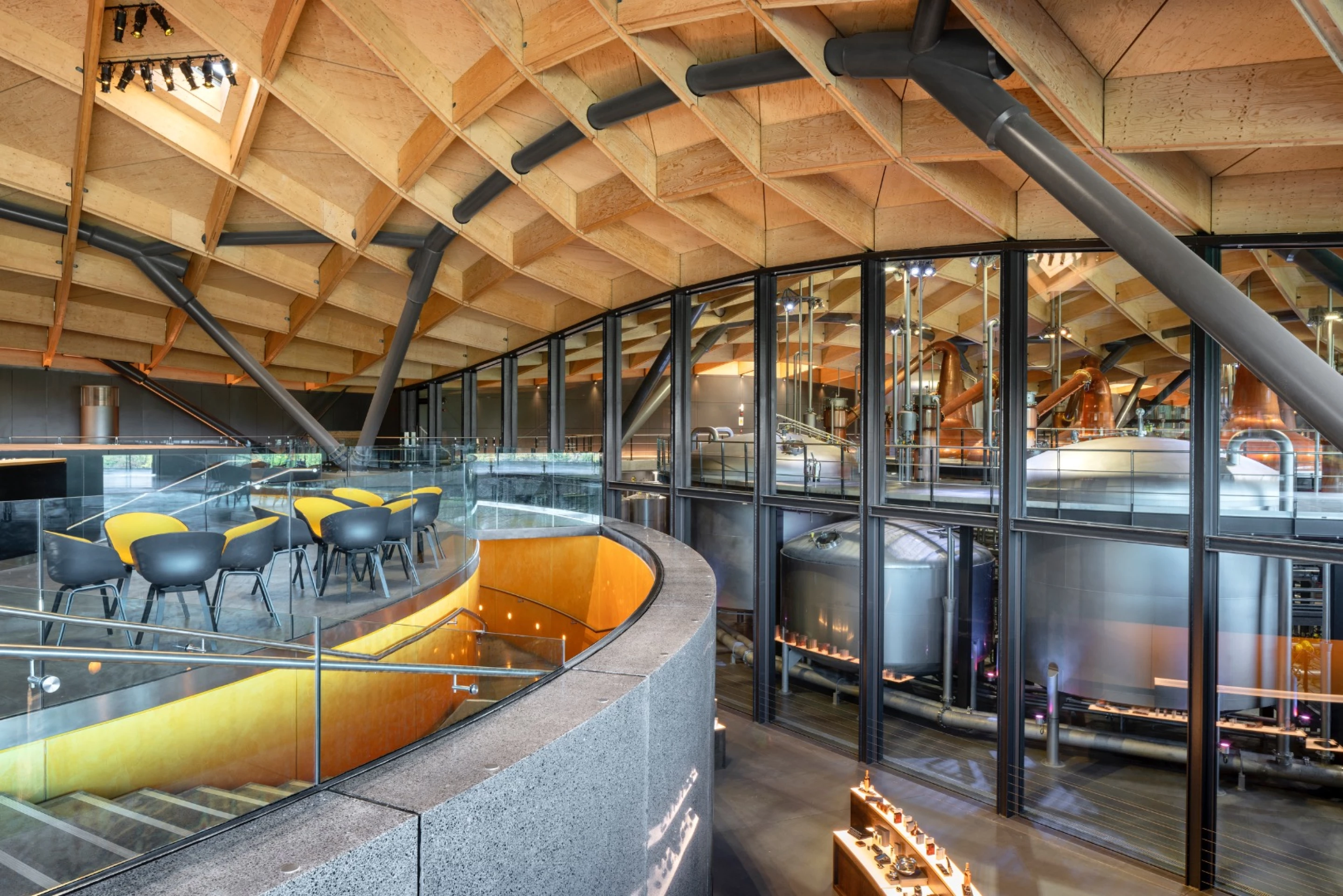 Scottish whisky distillery blends into the landscape with undulating ...