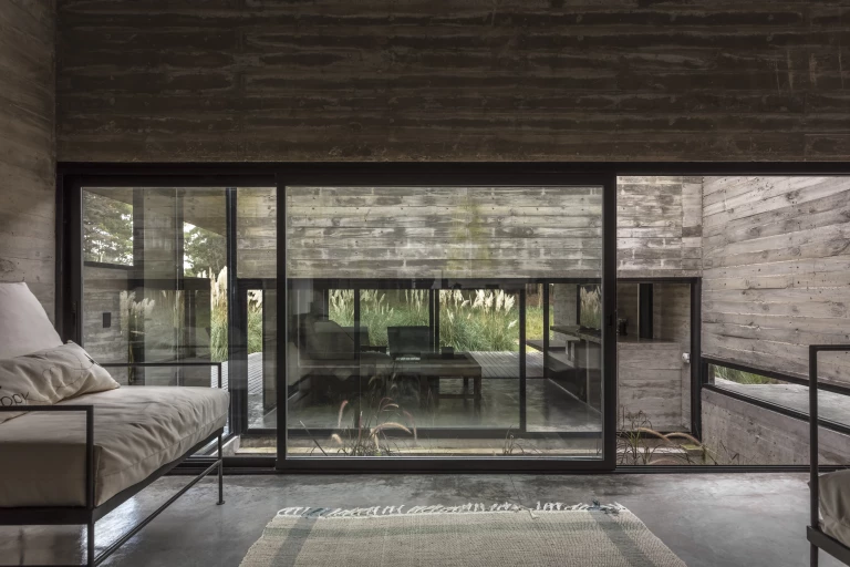 Striking Forest House keeps it concreted and classy on wooded coastline
