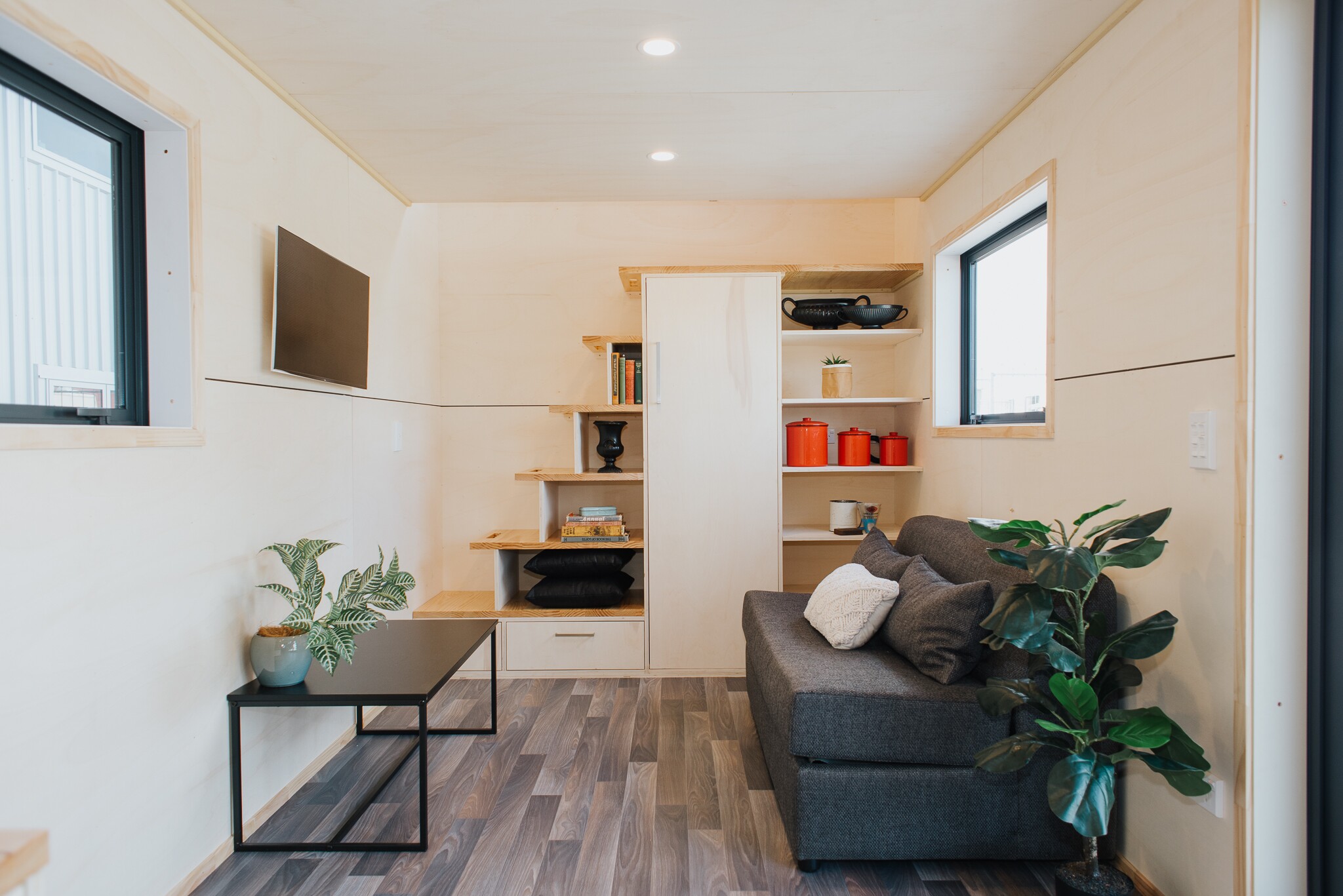 Turnkey tiny house squeezes in two storage-integrated staircases