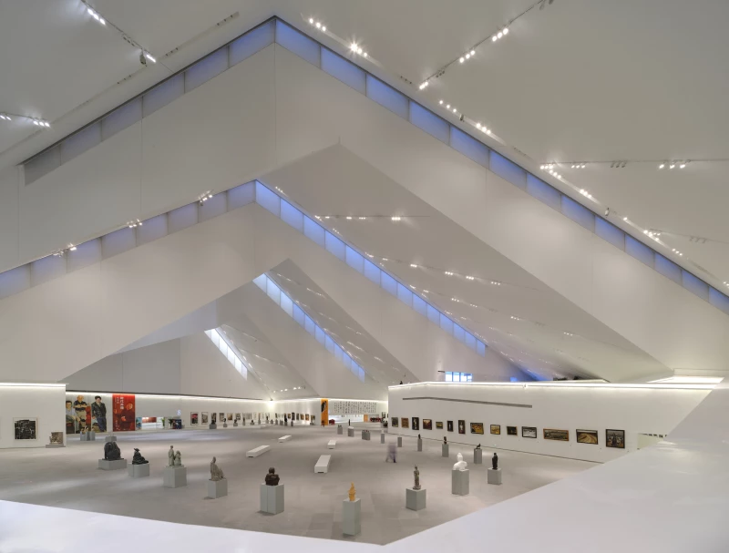Four overlapping steel pyramids form sunken art museum