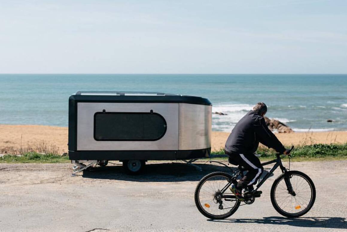 Sleek, compact camper pod grows to 3 times its size at the push of a button