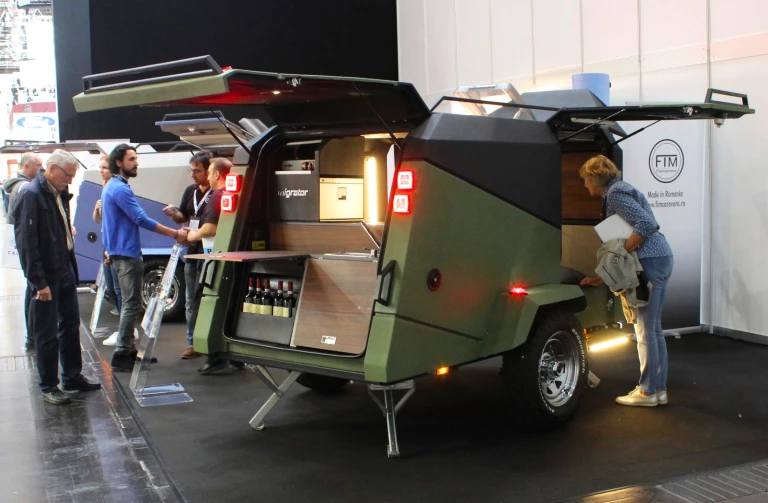 Gull-wing mini-caravan brings color and edge to the road less traveled