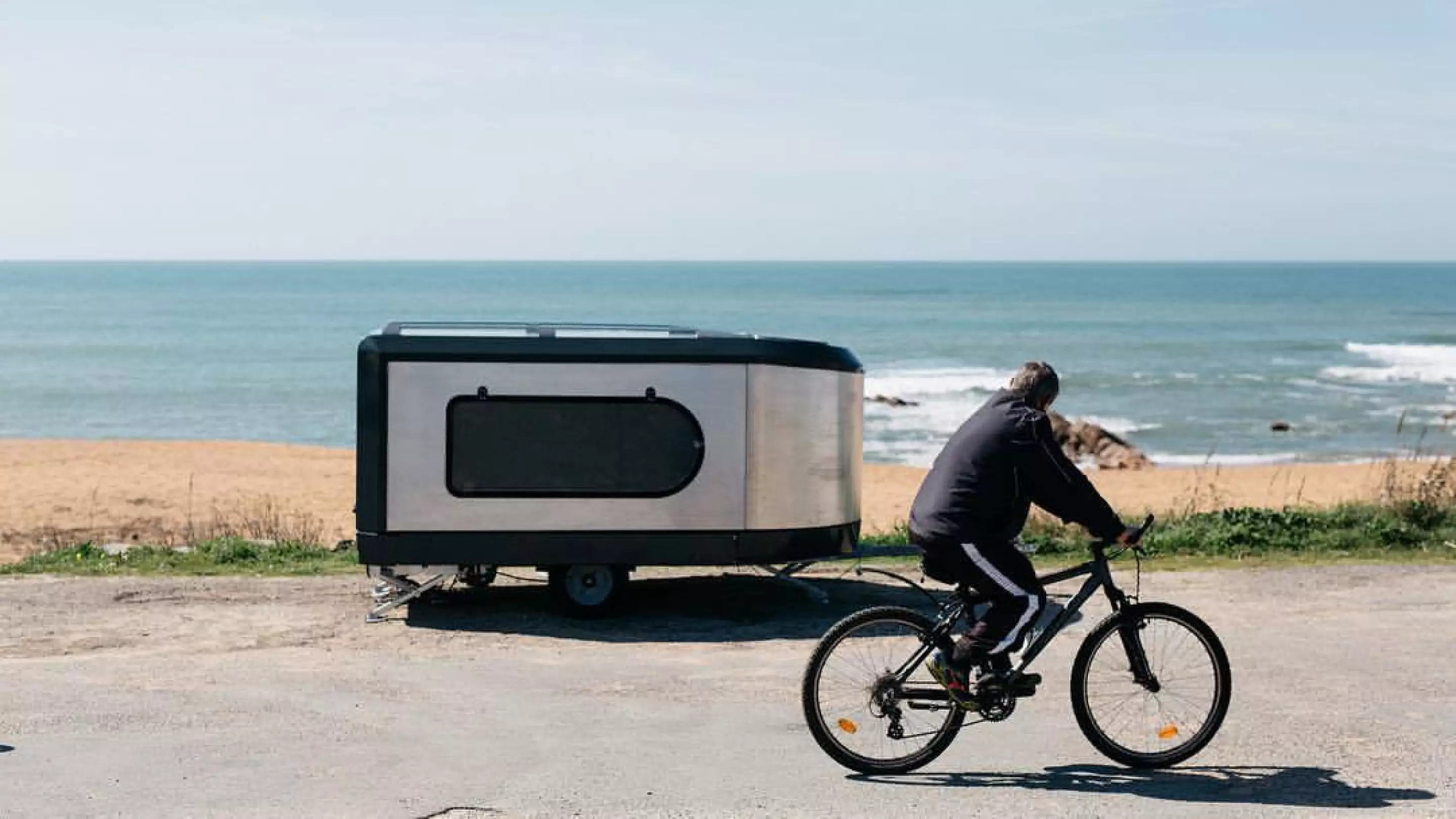 Sleek, compact camper pod grows to 3 times its size at the push of a button