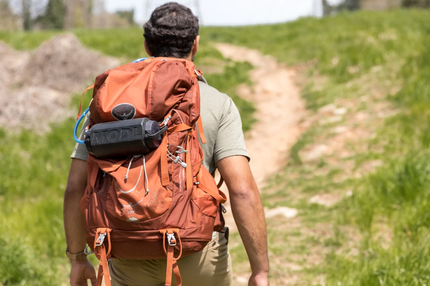 Multi-function water bottle serves as hydration pack, shower and more