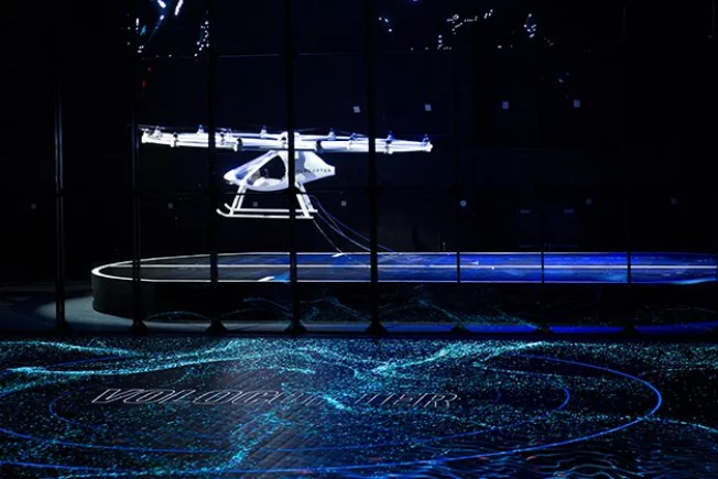 Volocopter flying taxi lifts off onstage at CES