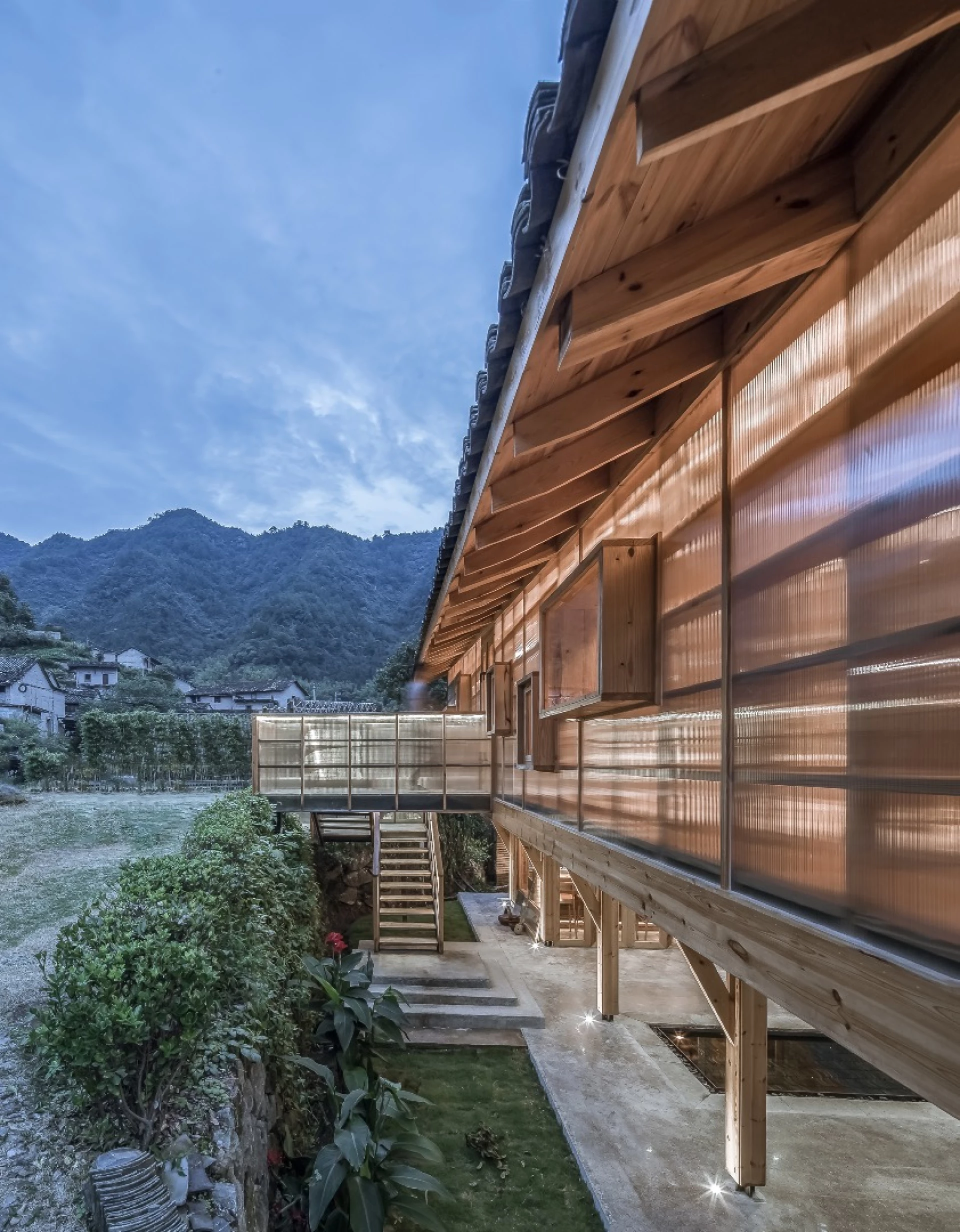 Elevated library glows invitingly in rural China