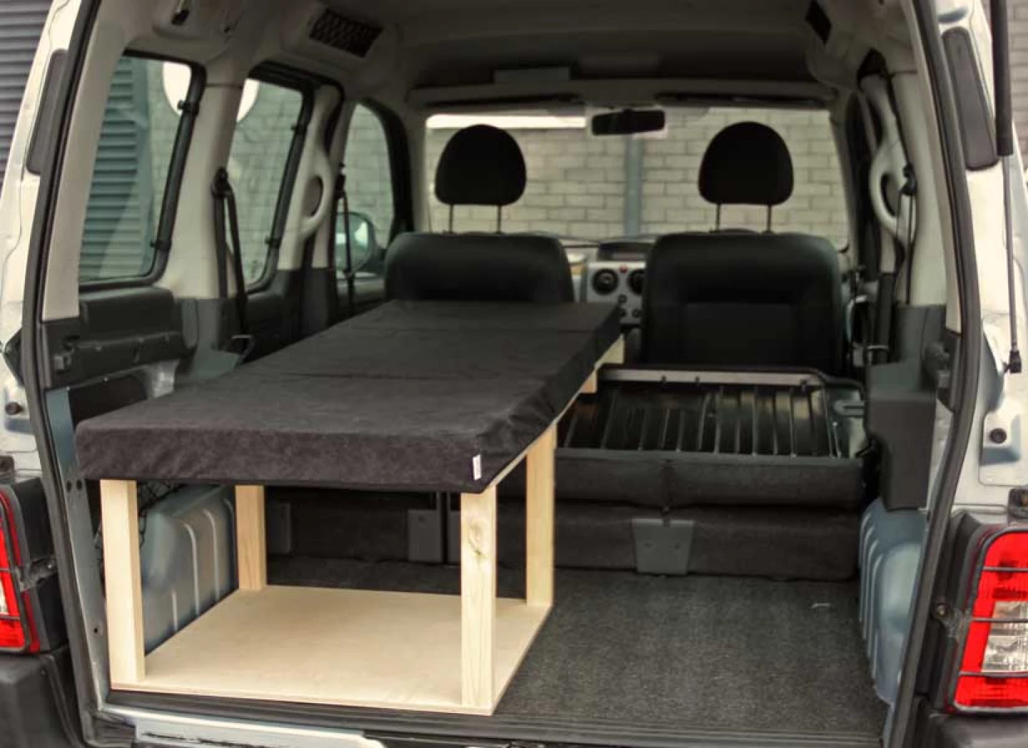 Simple kit turns small vans or crossovers into cozy micro campervans ...