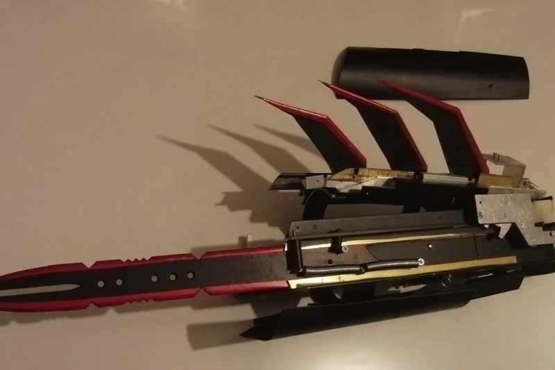 Batman gauntlet springs blades, shoots discs