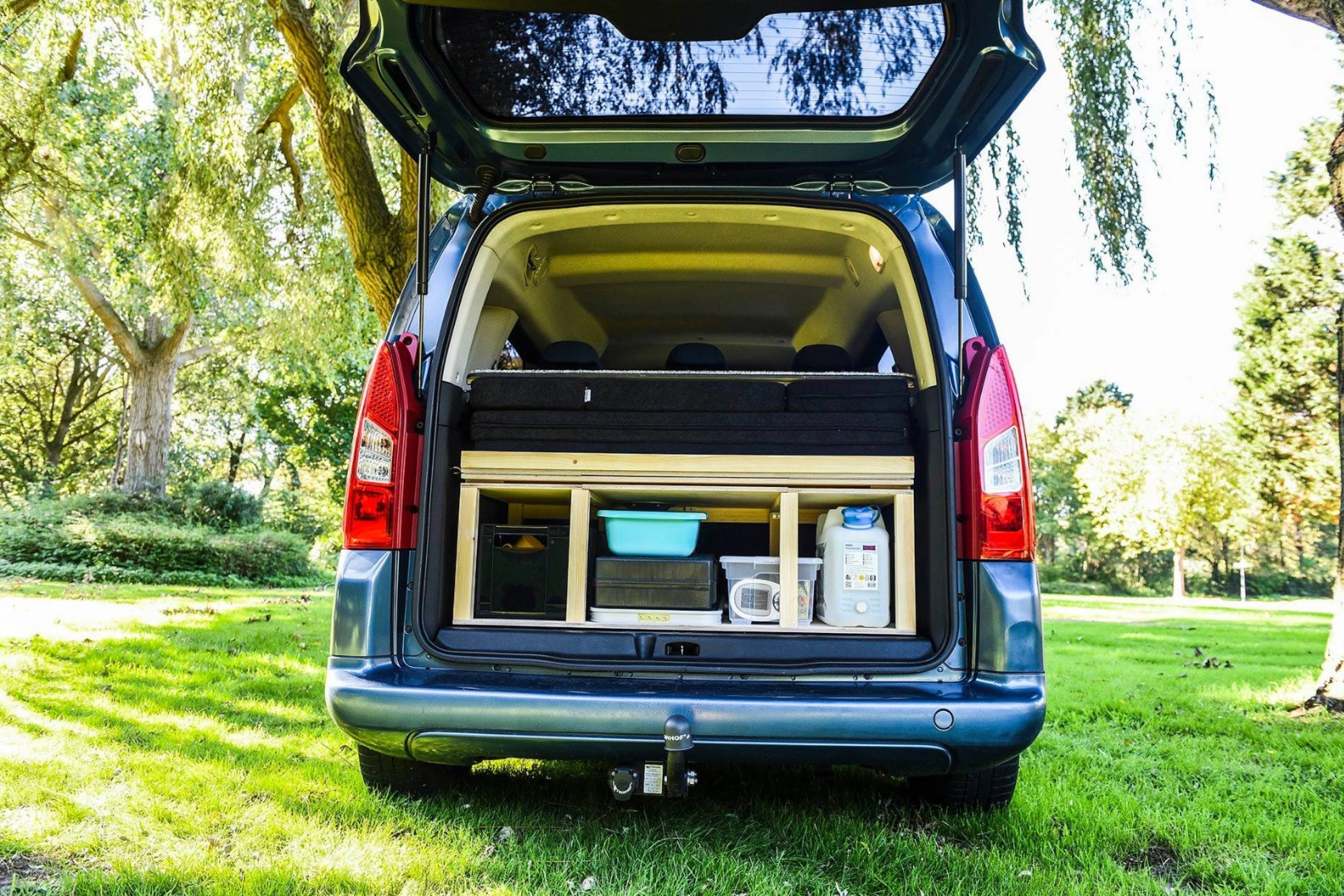 Simple kit turns small vans or crossovers into cozy micro campervans ...